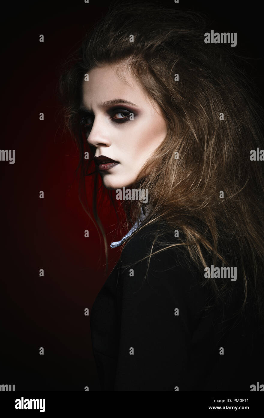 Dramatic portrait of a beautiful young sad girl Stock Photo - Alamy