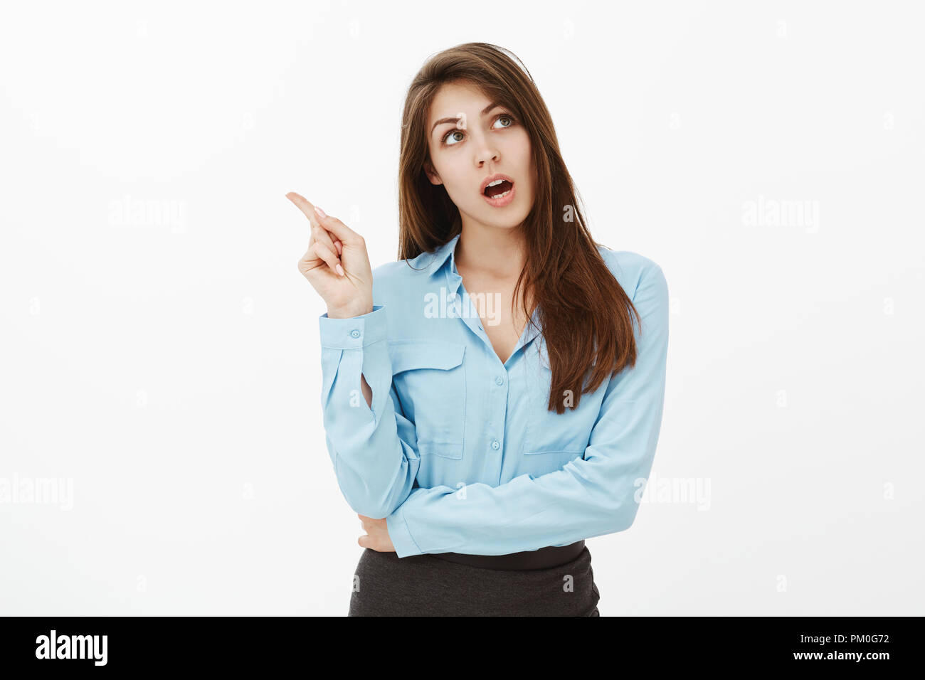 Dreamy empty-headed cute girl with brown hair, standing with opened ...