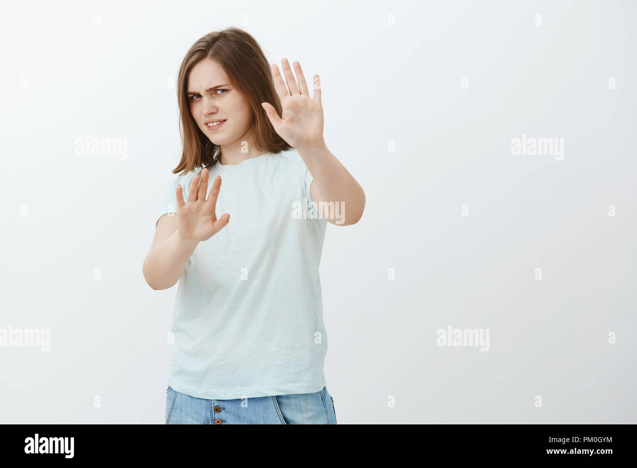 Take it away from me. Portrait of intense displeased and irritated cute ...