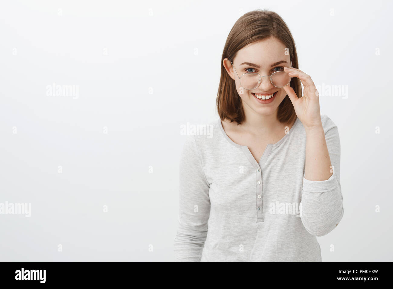 Waist-up shot of joyful creative and smart girlfriend with short brown ...
