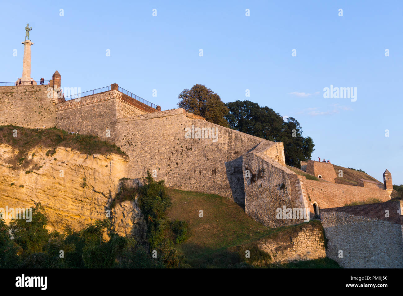 Outer defense walls of the Belgrade fortress Kalemegdan with the statue ...