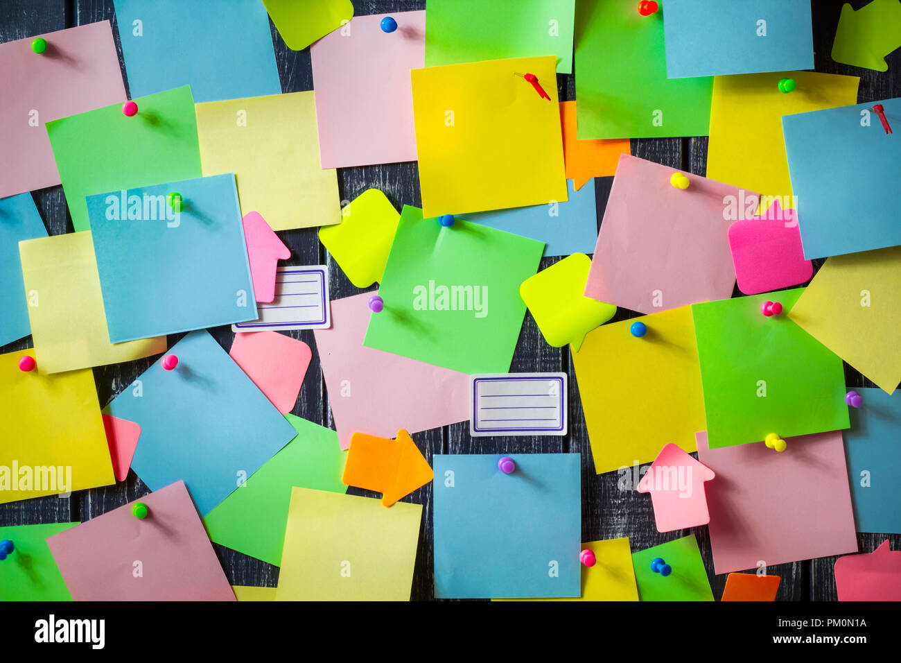 Stickers paper notes post it colored on the board. The concept of ...