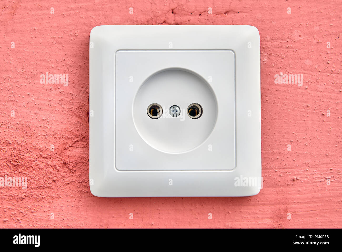 Wall electrical outlet of European type, square-shaped, white color ...