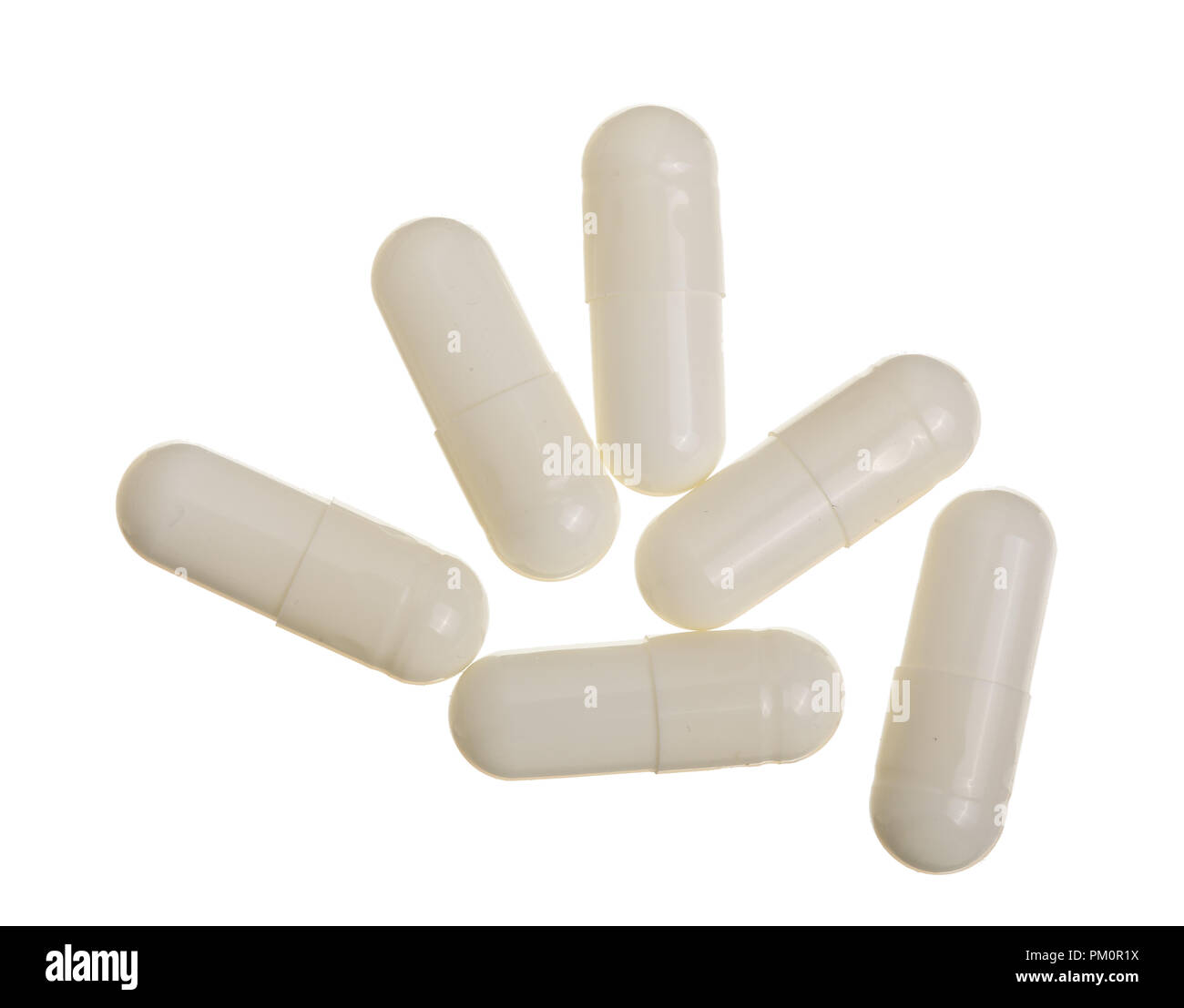 white pill capsule isolated on white background. Top view. Flat lay ...