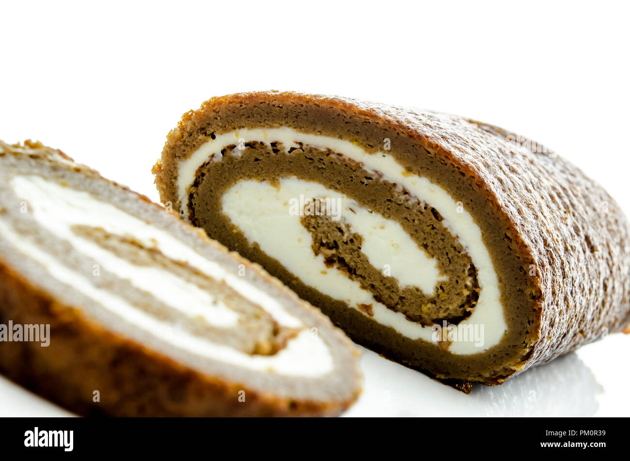 Delicious homemade roulade with cream isolated on a white background ...