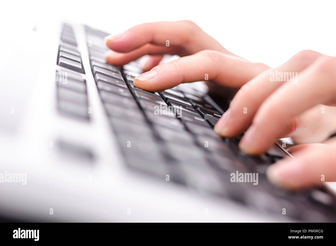 Closeup of female hands typing on keyboard. Shallow dof Stock Photo - Alamy