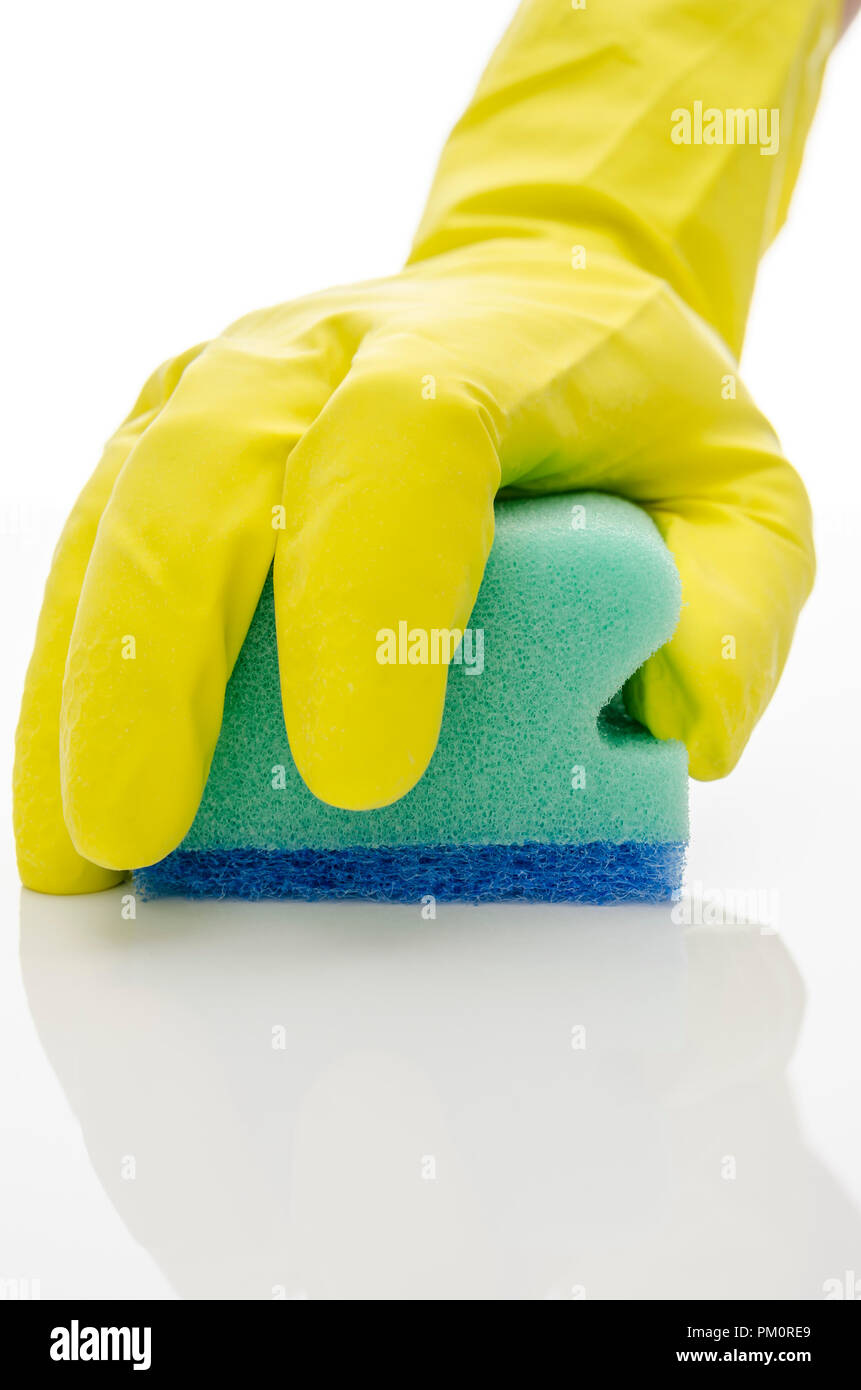 Hand in a rubber glove cleaning a white surface with a sponge Stock ...