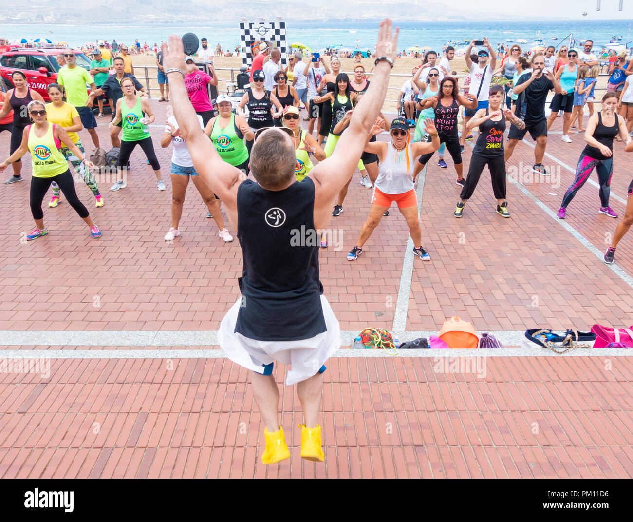 Zumba class overlooking beach in Spain Stock Photo - Alamy