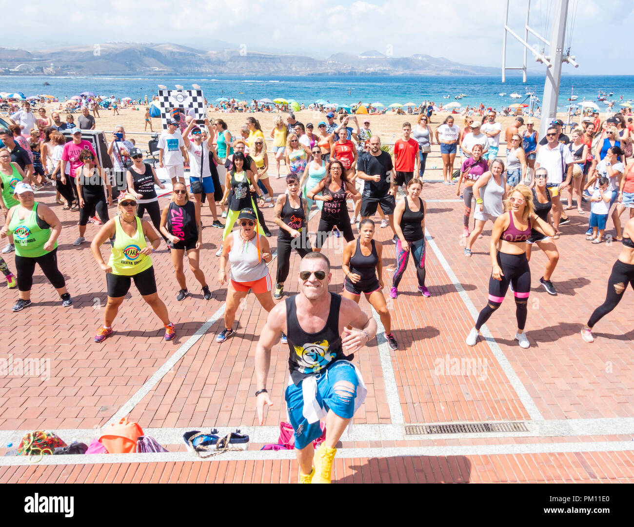 Zumba class overlooking beach in Spain Stock Photo - Alamy