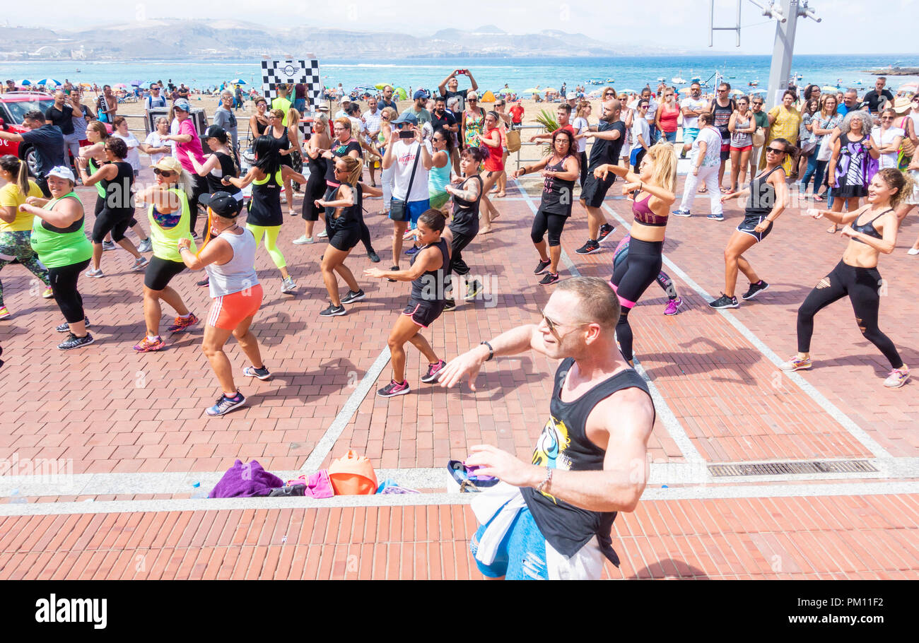 Zumba class overlooking beach in Spain Stock Photo - Alamy