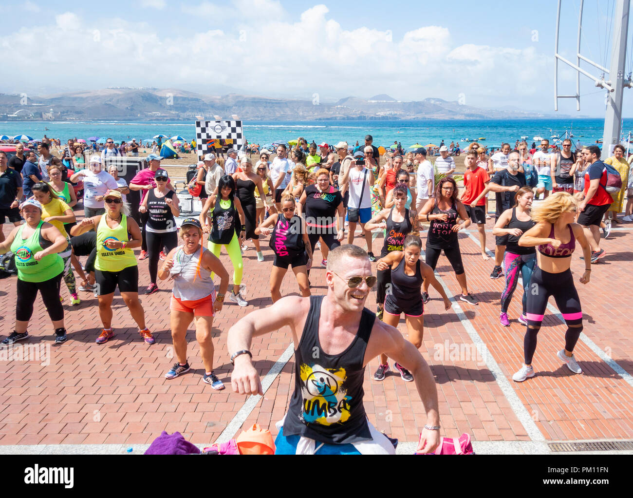 Zumba class overlooking beach in Spain Stock Photo - Alamy