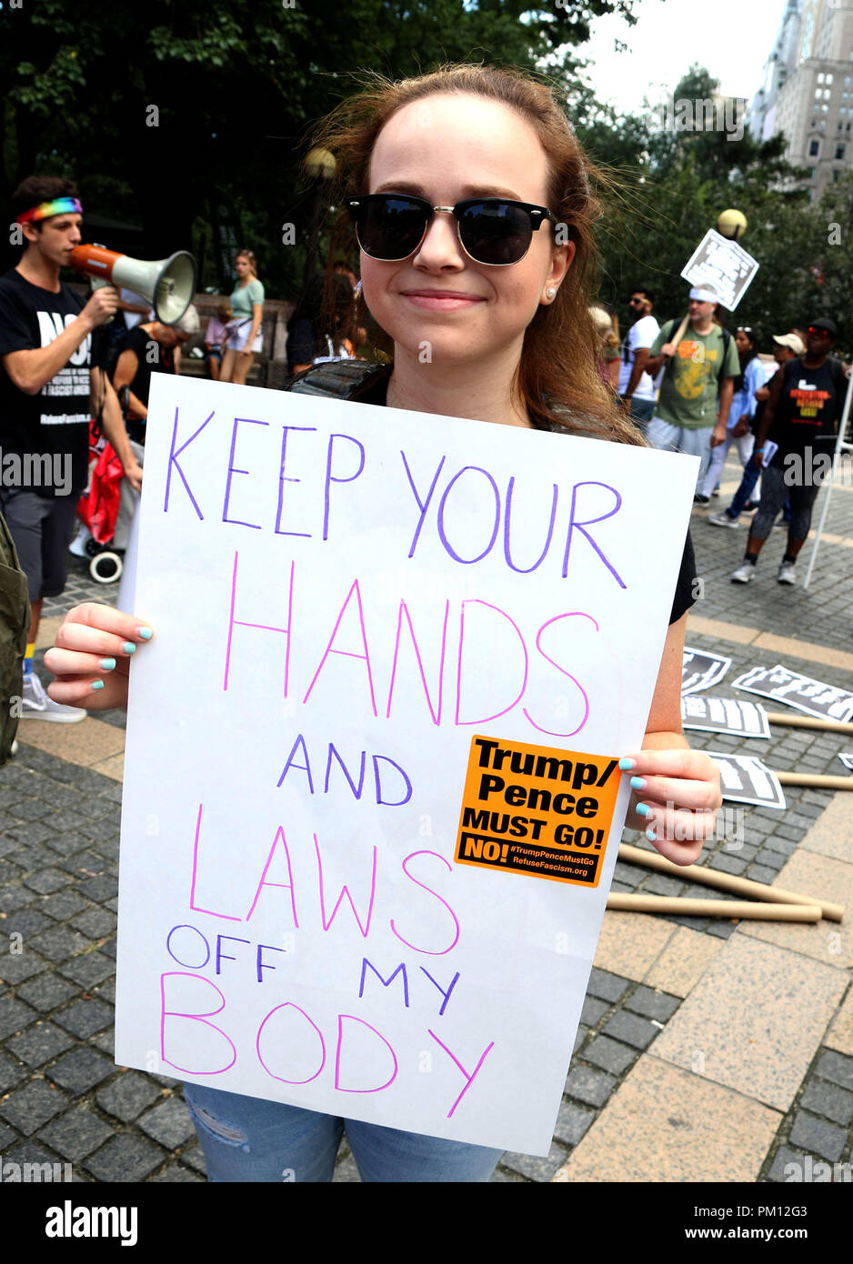 New York City, New York, USA. 15th Sep, 2018. An activist protests ...