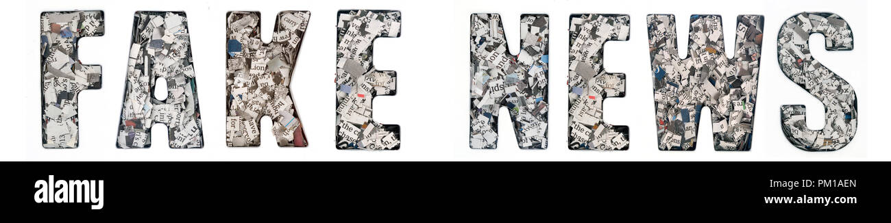 the word FAKE NEWS made up of lots of cut up newspaper isolated Stock ...
