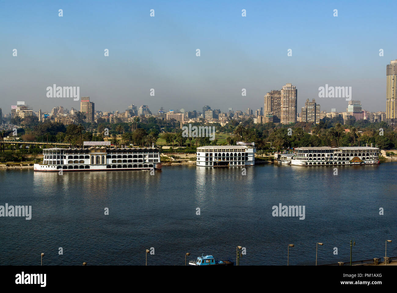Nile River on its way through the city of Cairo, Egypt with boats ...