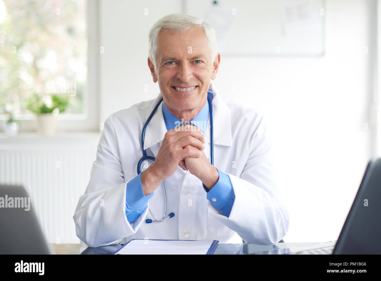 Male doctor laptop looking camera hi-res stock photography and images ...