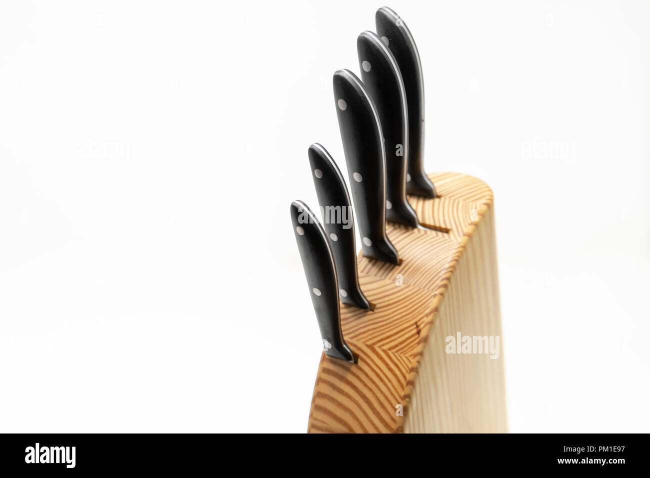 The handles and top of a knife block against a white background Stock ...