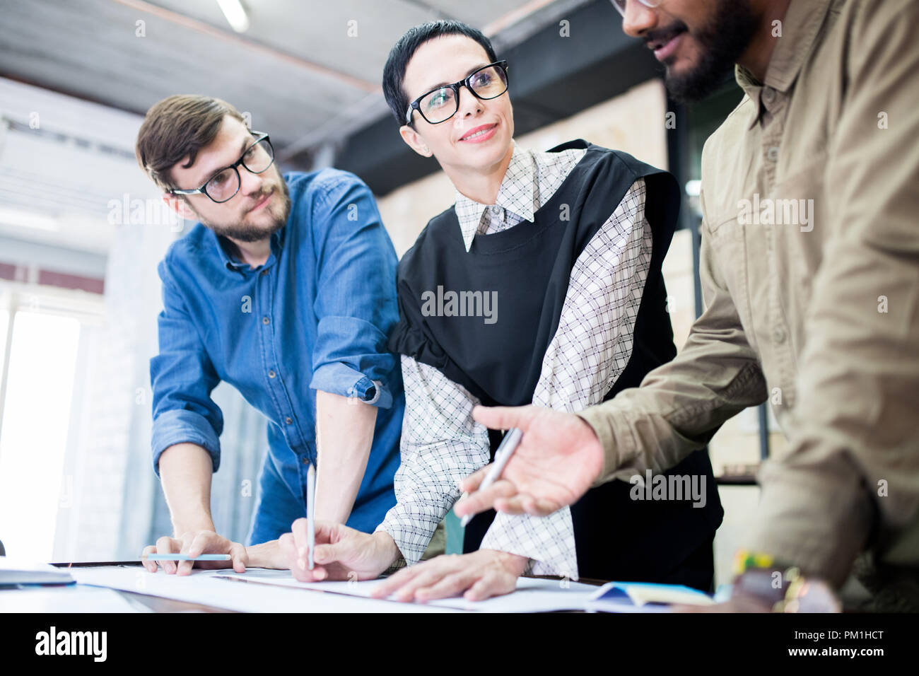 Working in team at office Stock Photo - Alamy