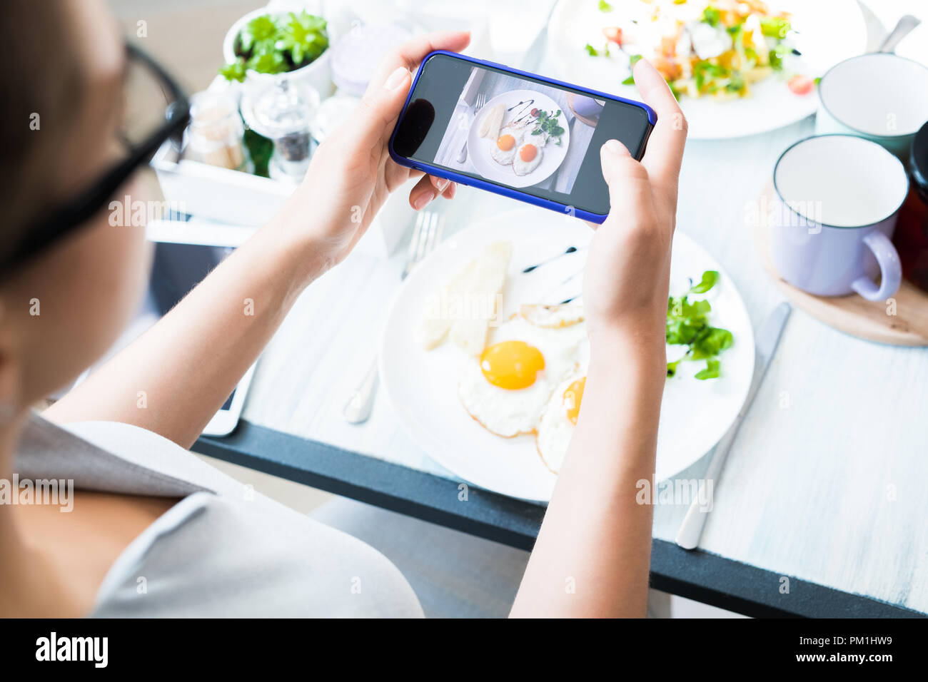 Woman taking photo food in hi-res stock photography and images - Alamy