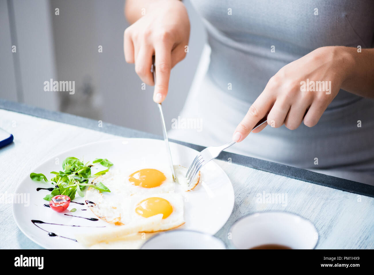 Female eating eggs hi-res stock photography and images - Alamy