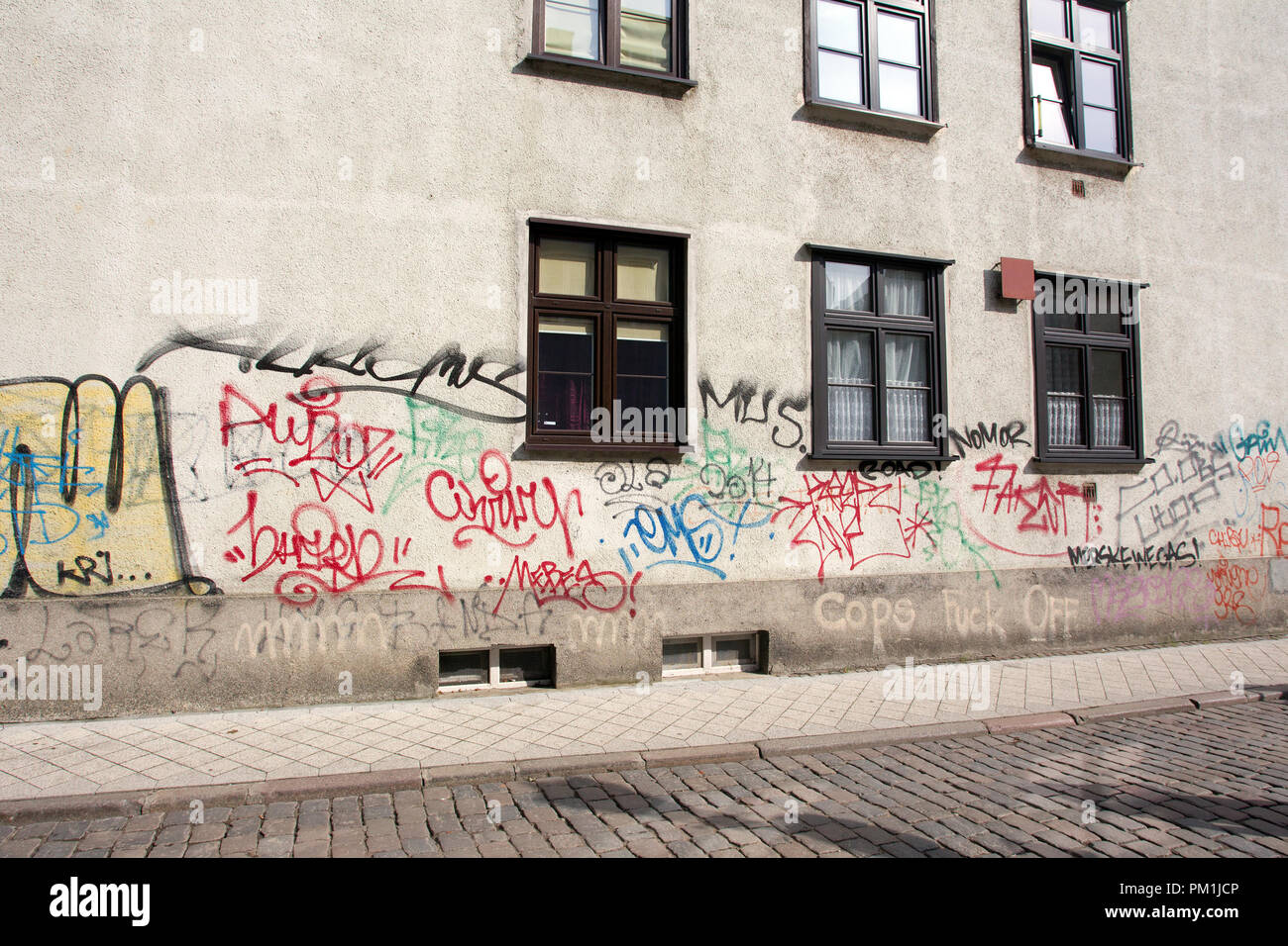 Graffiti with profanity on building in old town gdansk hi-res stock ...