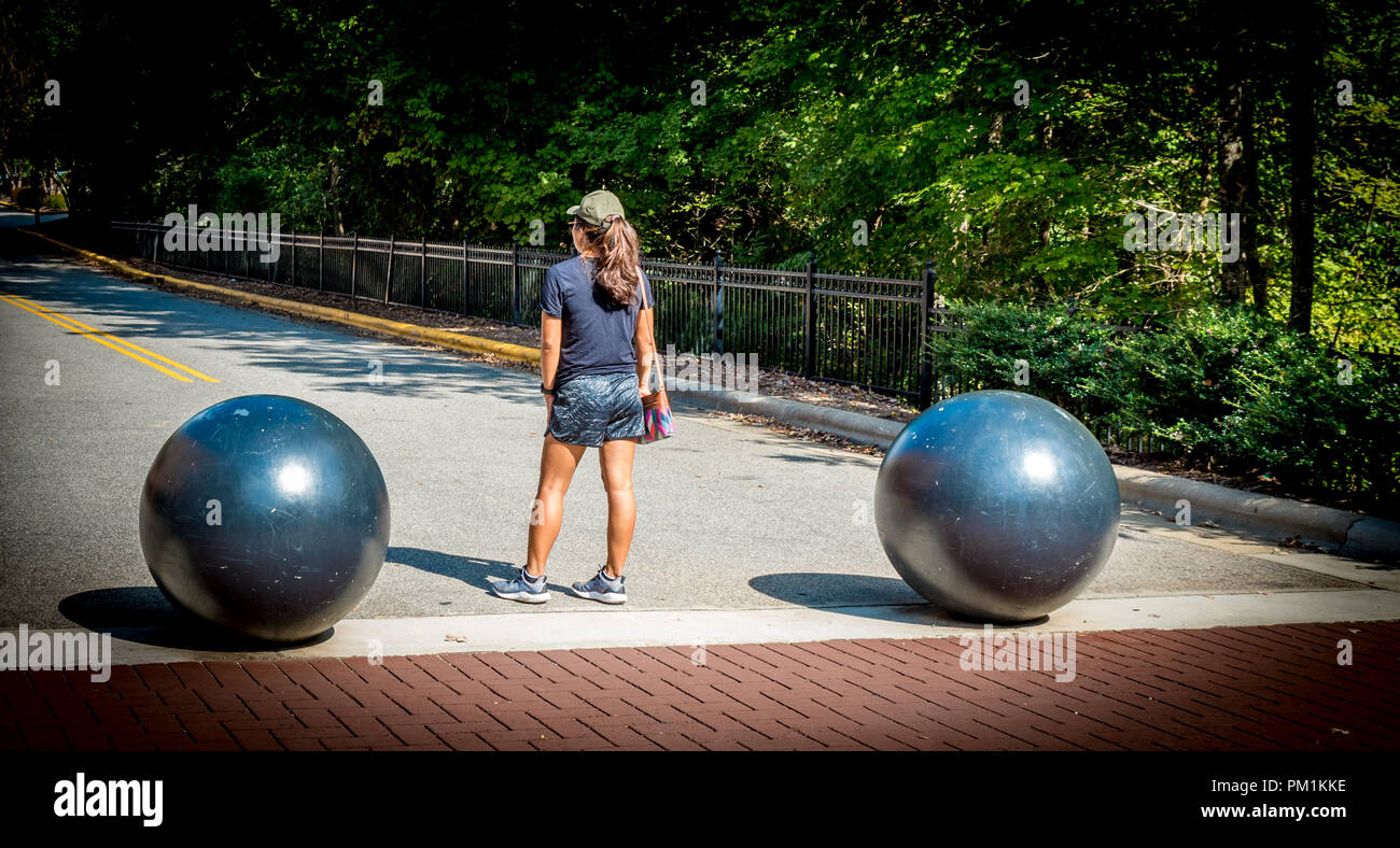Woman and giant balls hi-res stock photography and images - Alamy