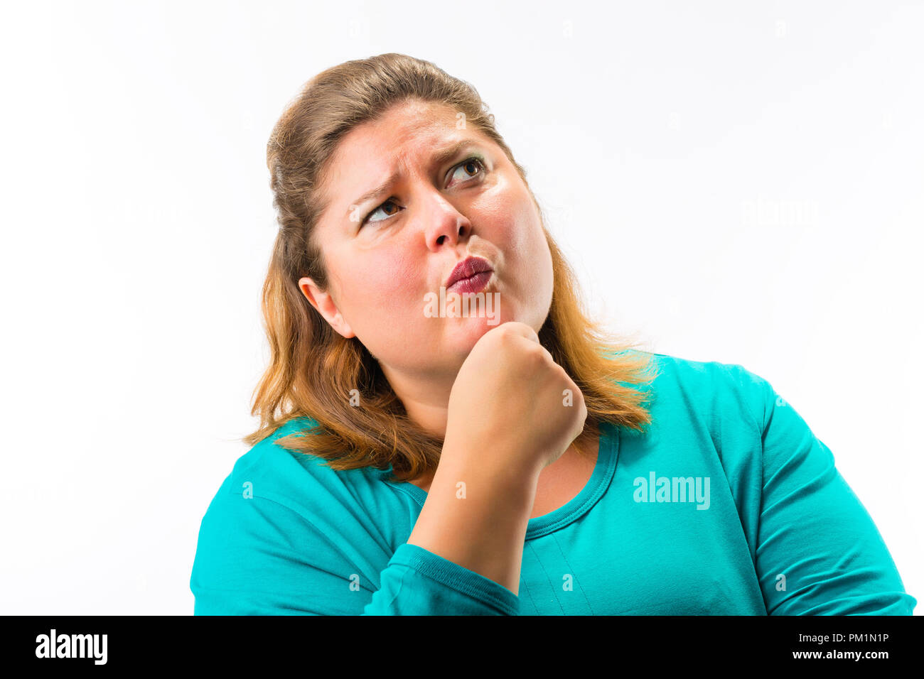 Close-up of woman thinking Stock Photo - Alamy