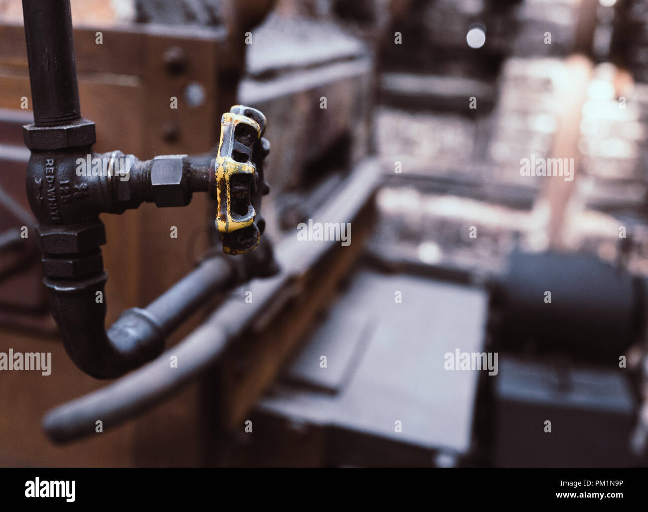 plumbing in an old factory Stock Photo - Alamy