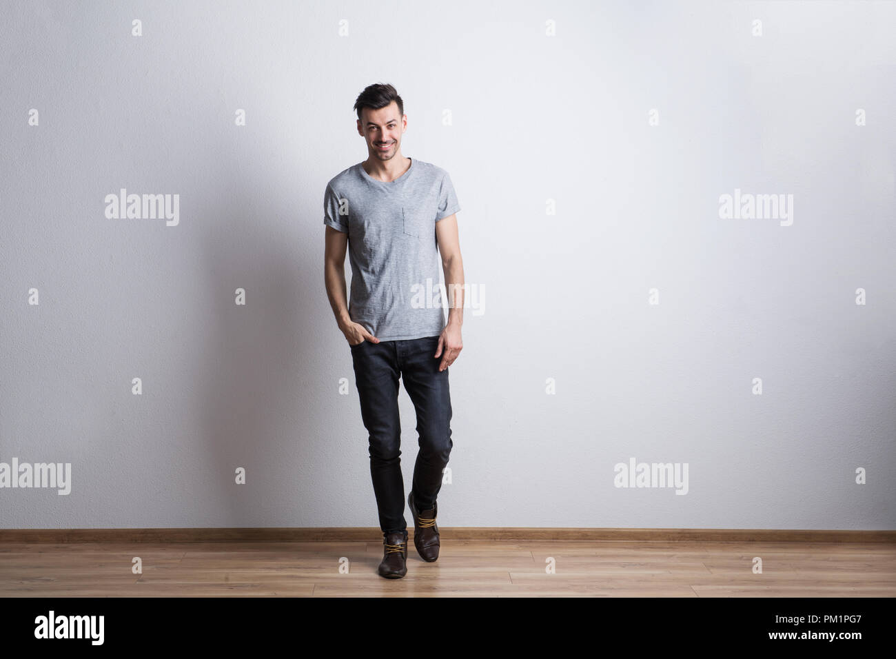Full length portrait of a young man in a studio. Copy space Stock Photo ...