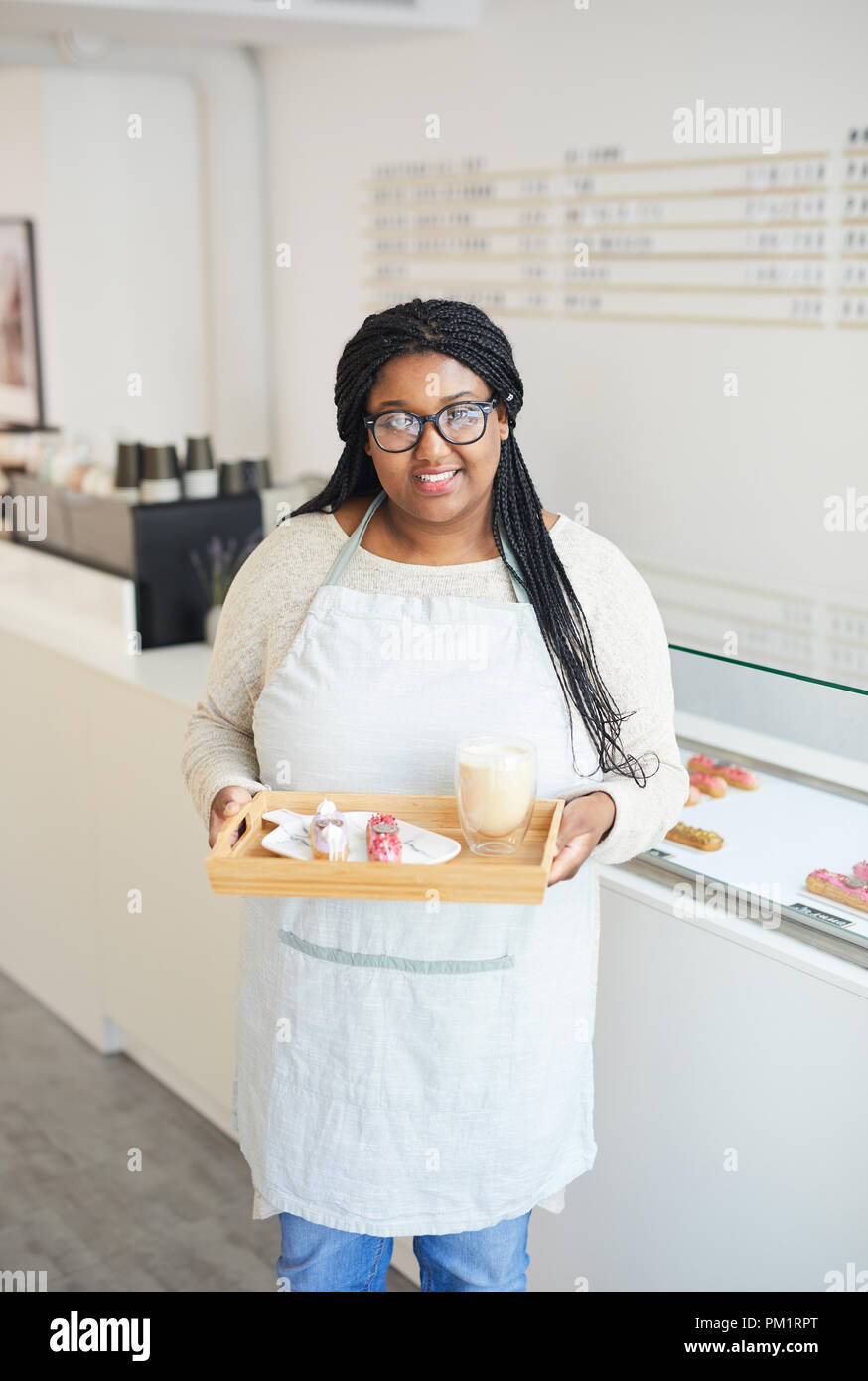 Young woman carrying tray hi-res stock photography and images - Alamy