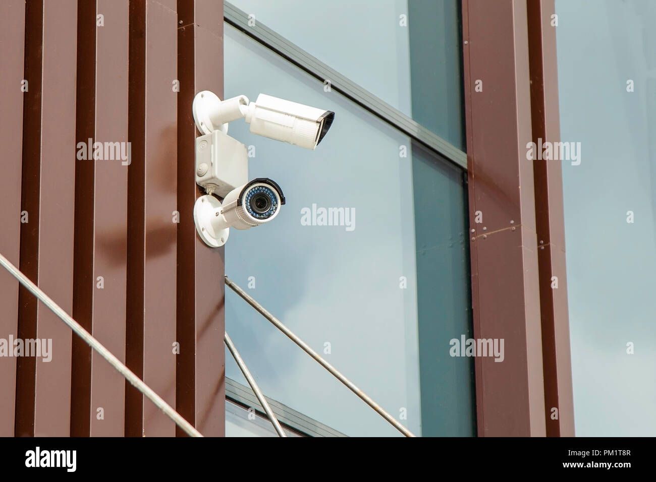 CCTV cameras on the wall of the building Stock Photo - Alamy