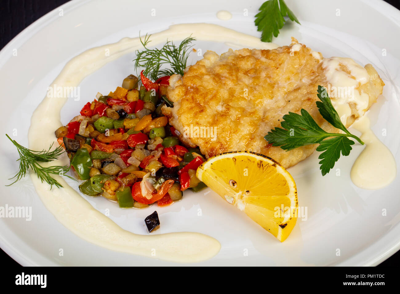 Tasty fried cod with lemon Stock Photo - Alamy