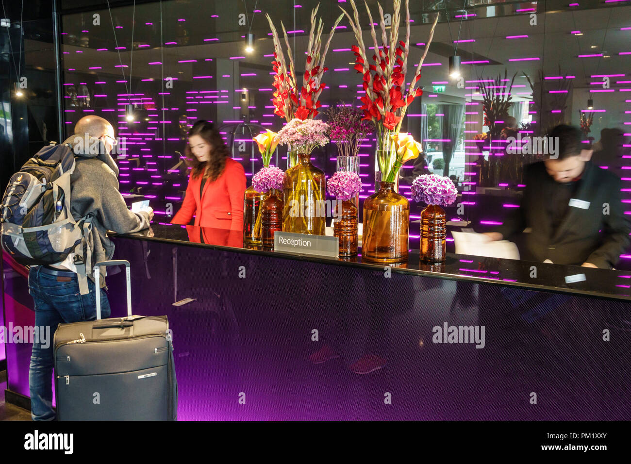 Inside interior lobby front check in reception desk hi-res stock ...