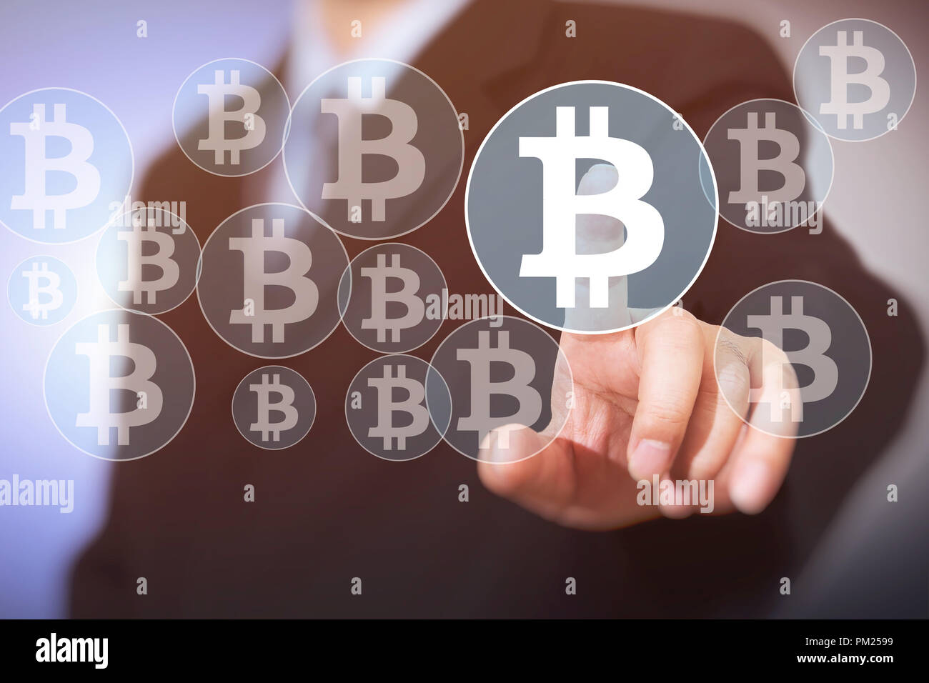Bitcoin button on virtual interface displaying, businessman touching ...