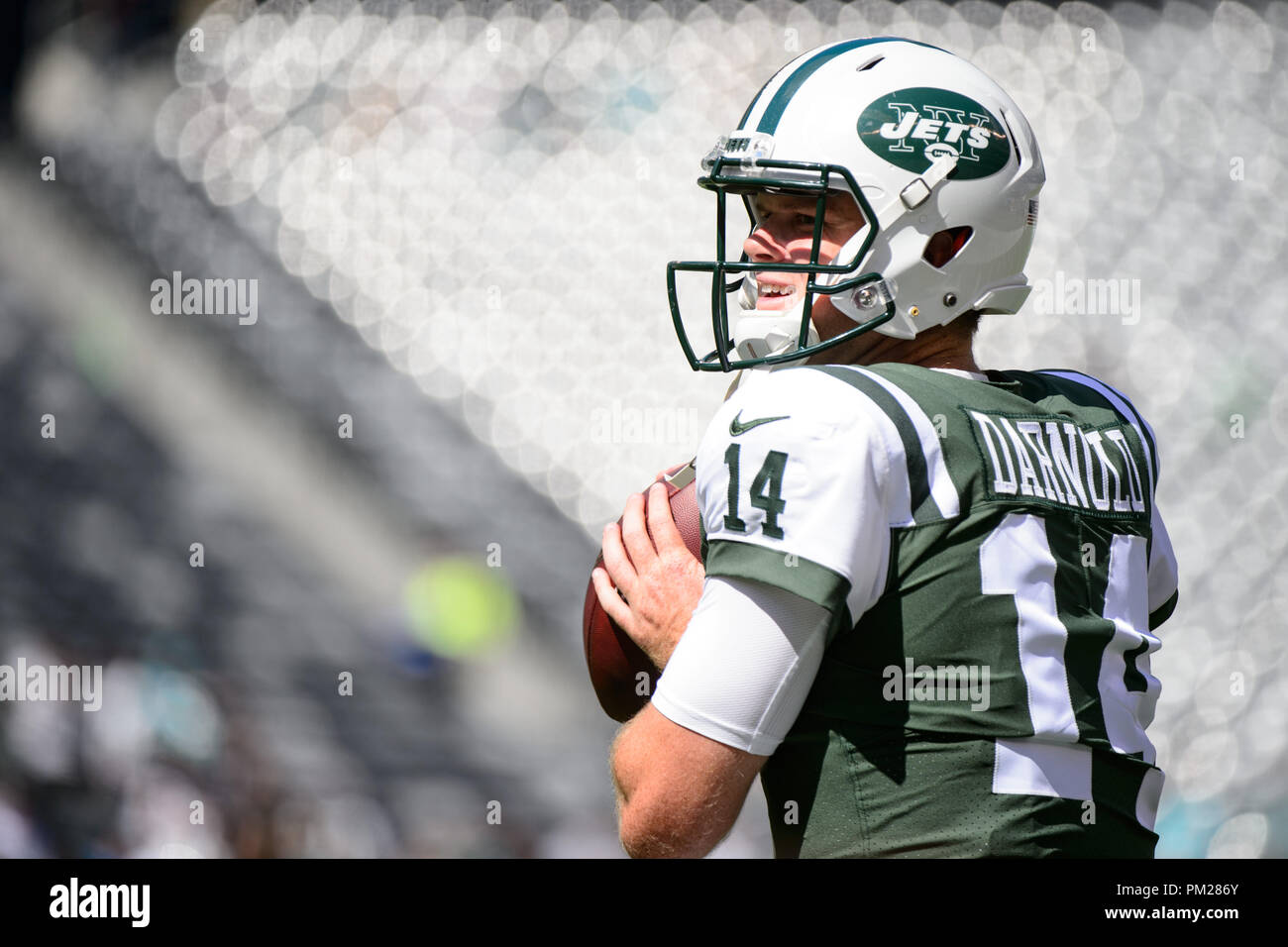 East Rutherford, NJ, USA. 16th Sep, 2018. New York Jets quarterback Sam Darnold (14) warms up ...