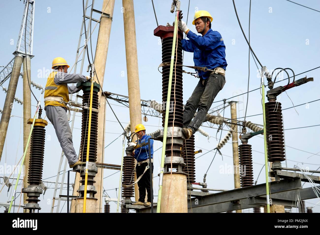 Qixian, China's Henan Province. 17th Sep, 2018. Power workers upgrade ...