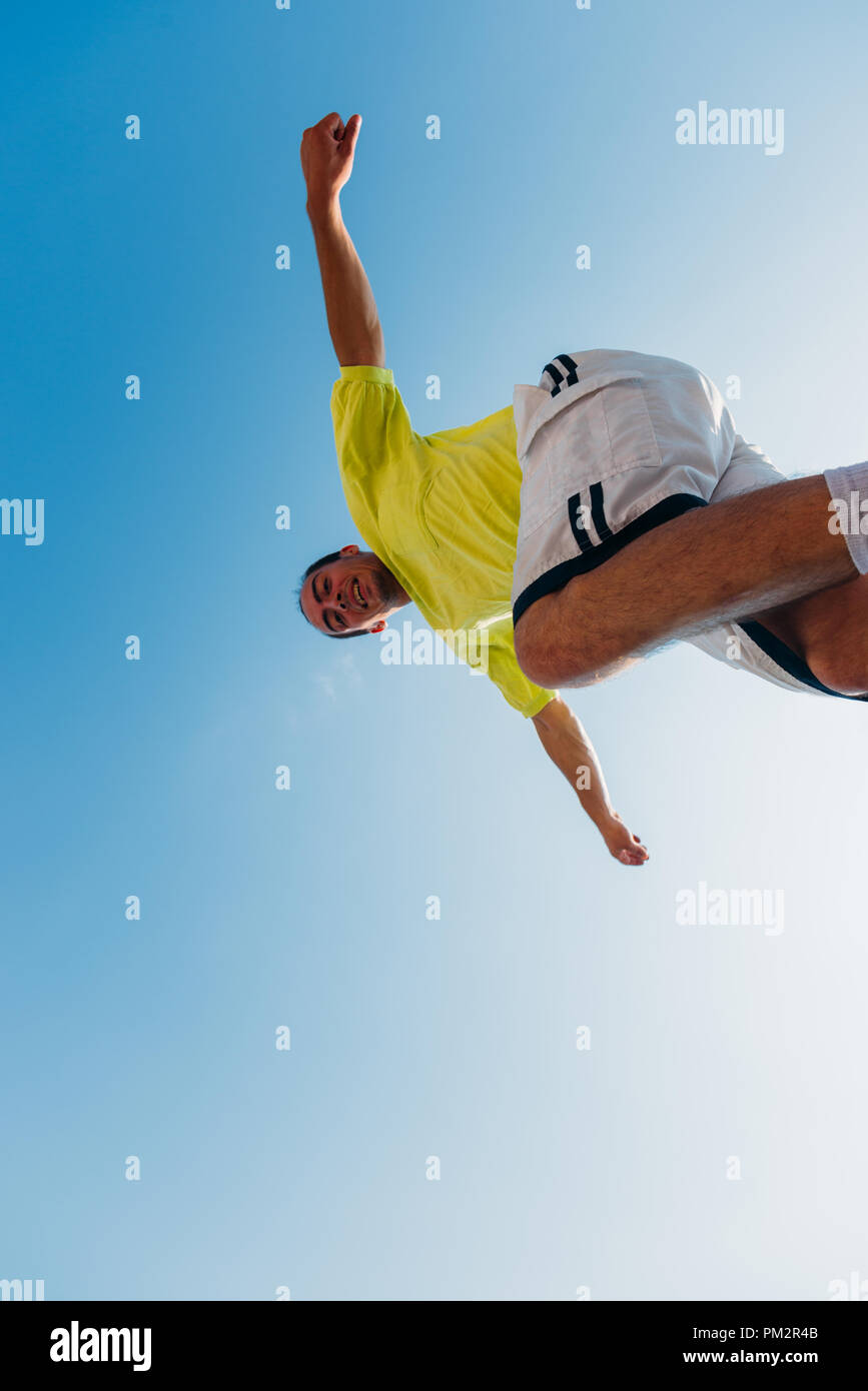 Free runner make parkour in the air while jumping outdoor Stock Photo ...