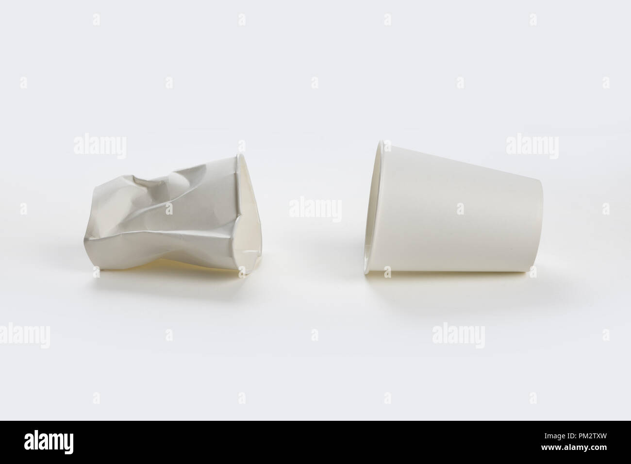 Crumbled White paper coffee cup on white background Stock Photo - Alamy