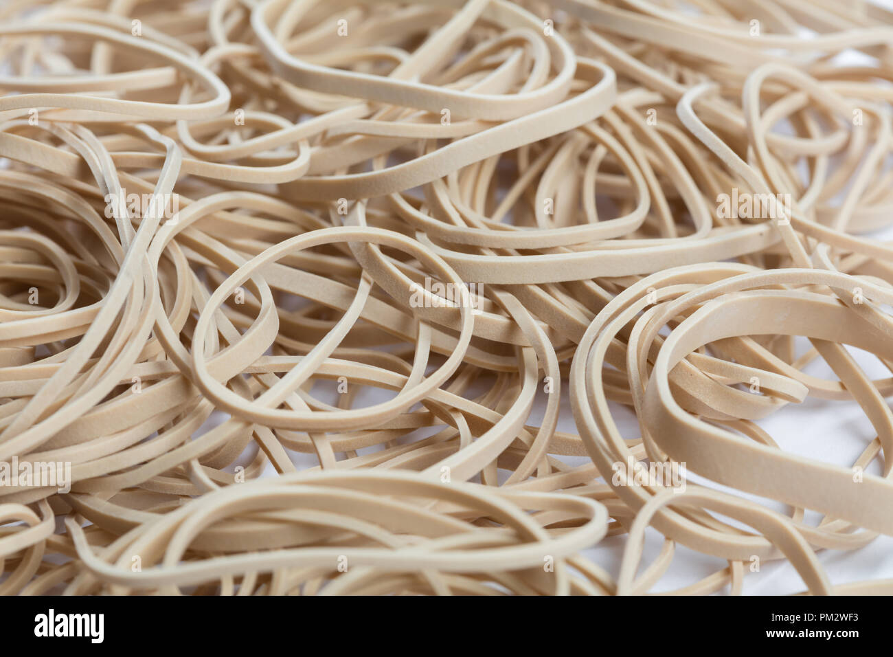 yellow Rubber Band close up for background Stock Photo - Alamy