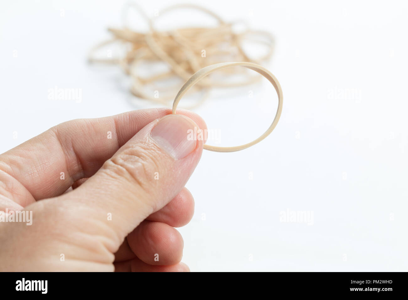 yellow Rubber Band with white background Stock Photo - Alamy