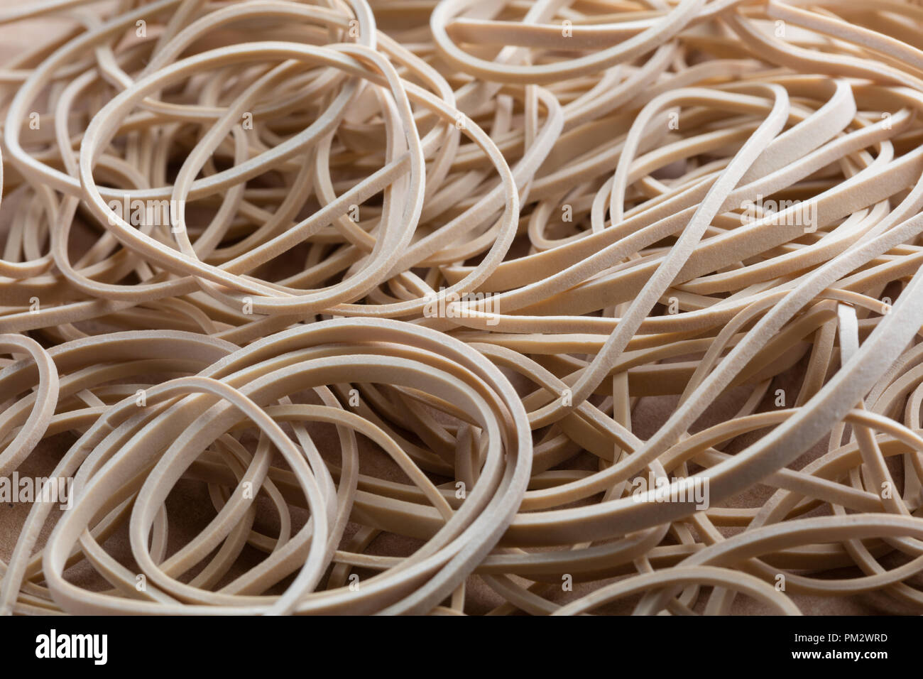 yellow Rubber Band close up for background Stock Photo - Alamy