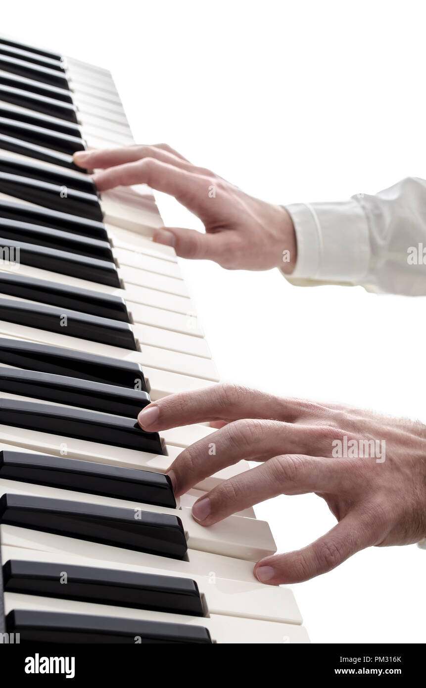 Male hands playing digital piano. Isolated over white background Stock ...