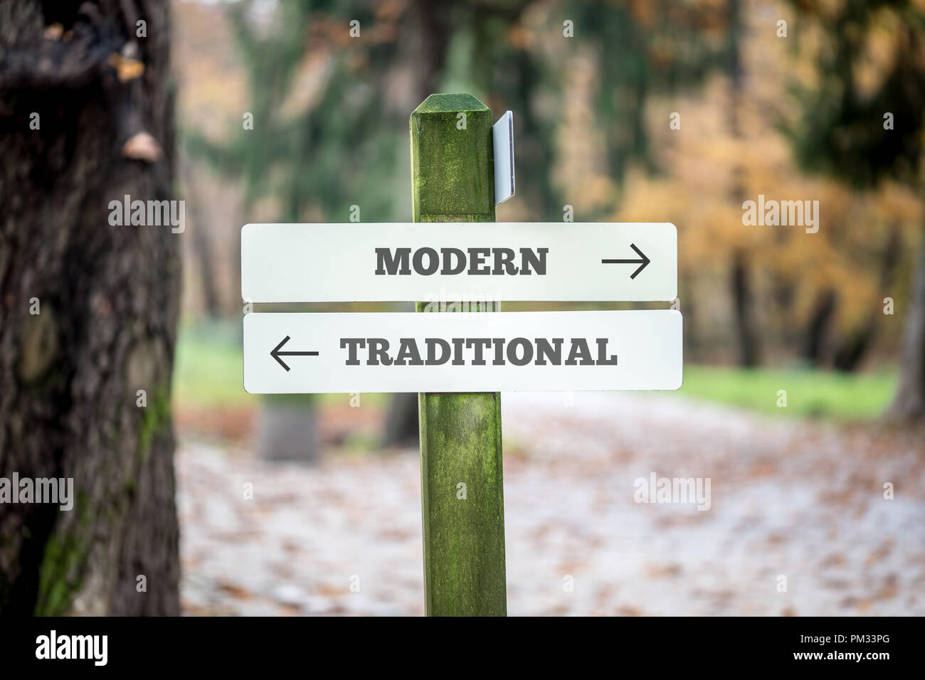 Rural signboard with two signs saying - Modern - Traditional - pointing ...