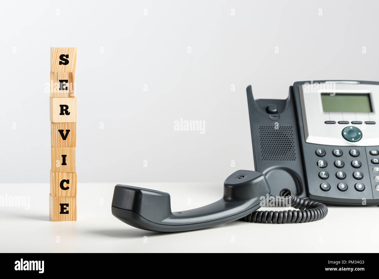 Service concept with the word Service written on stacked wooden cubes ...