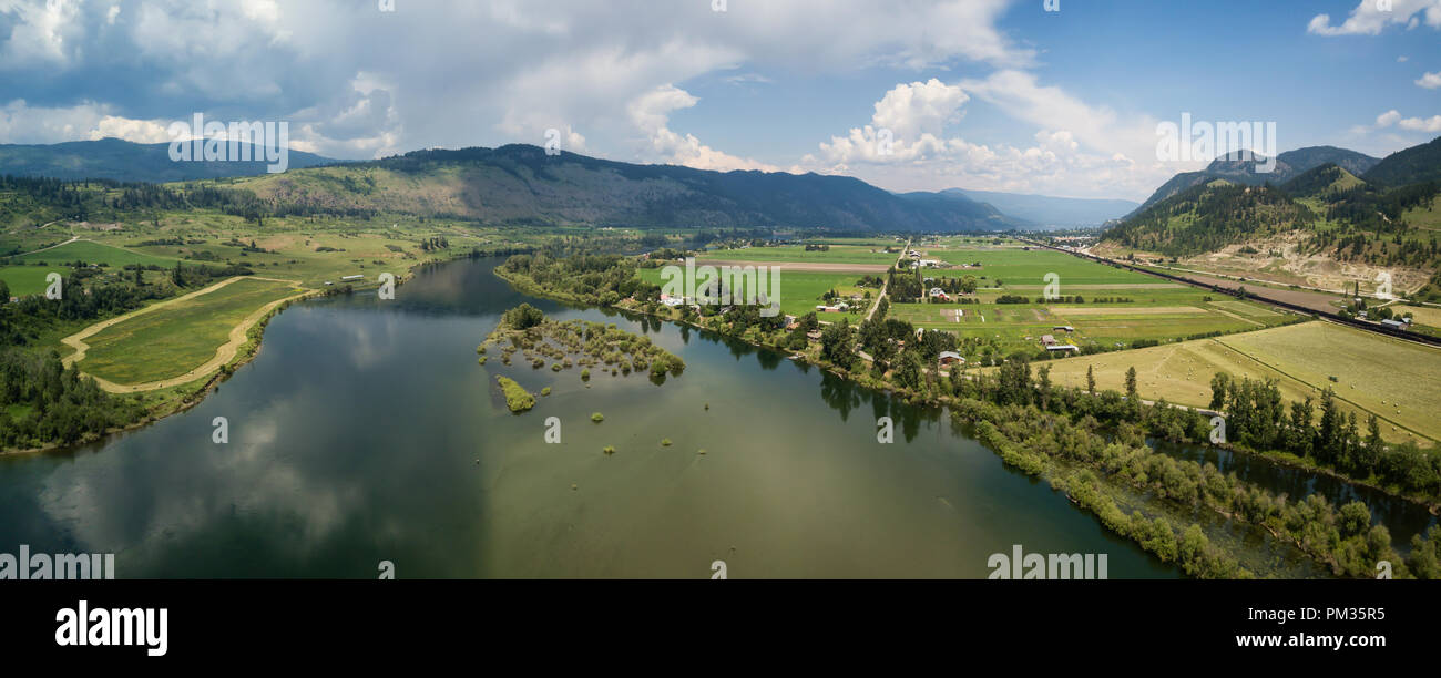 Aerial panoramic view of the Farm fields by Thompson River during a ...