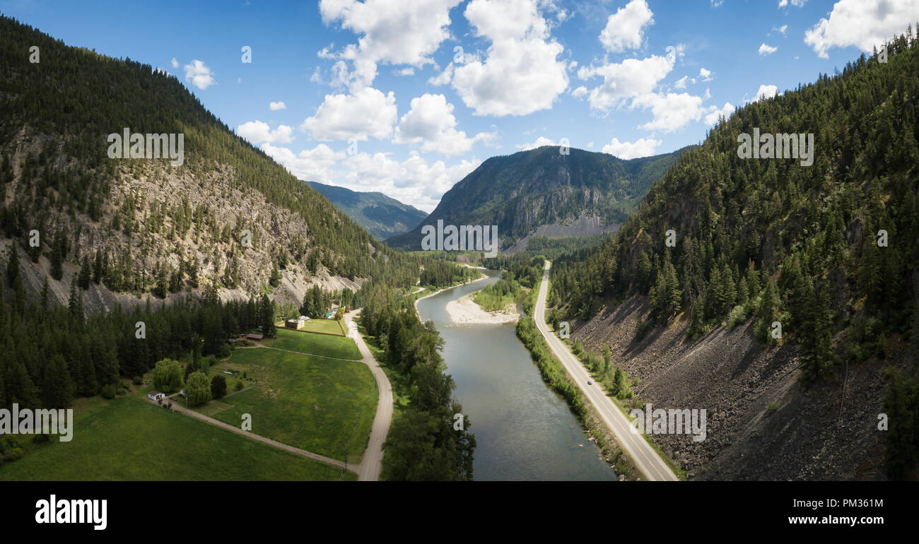 Aerial panoramic view of a scenic road going through the valley ...