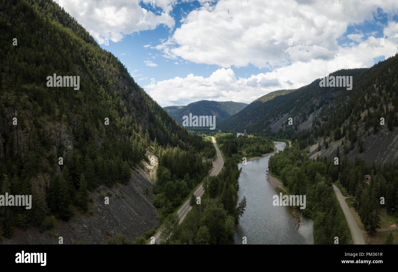 Aerial panoramic view of a scenic road going through the valley ...