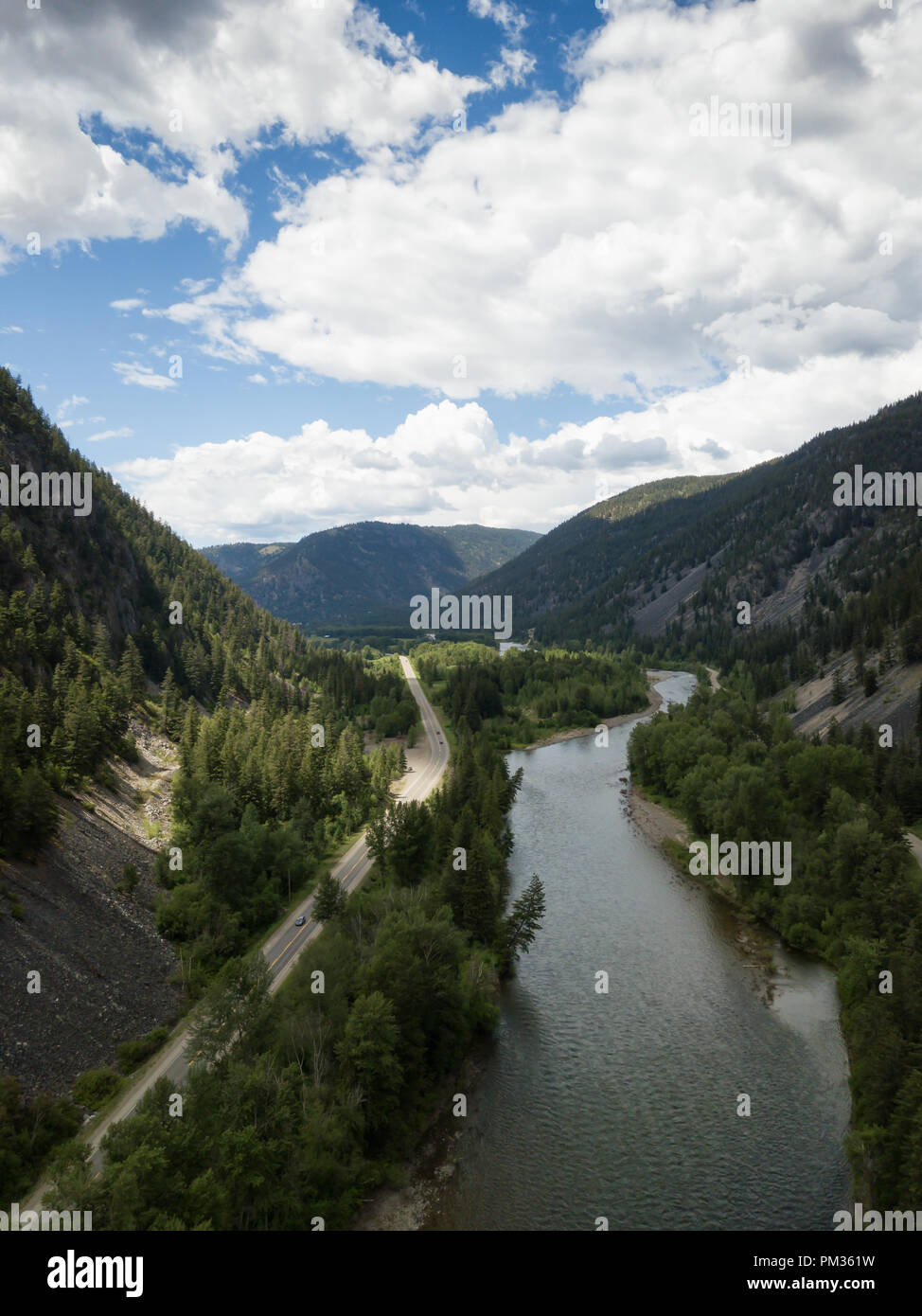 Aerial view of a scenic road going through the valley surrounded by the ...
