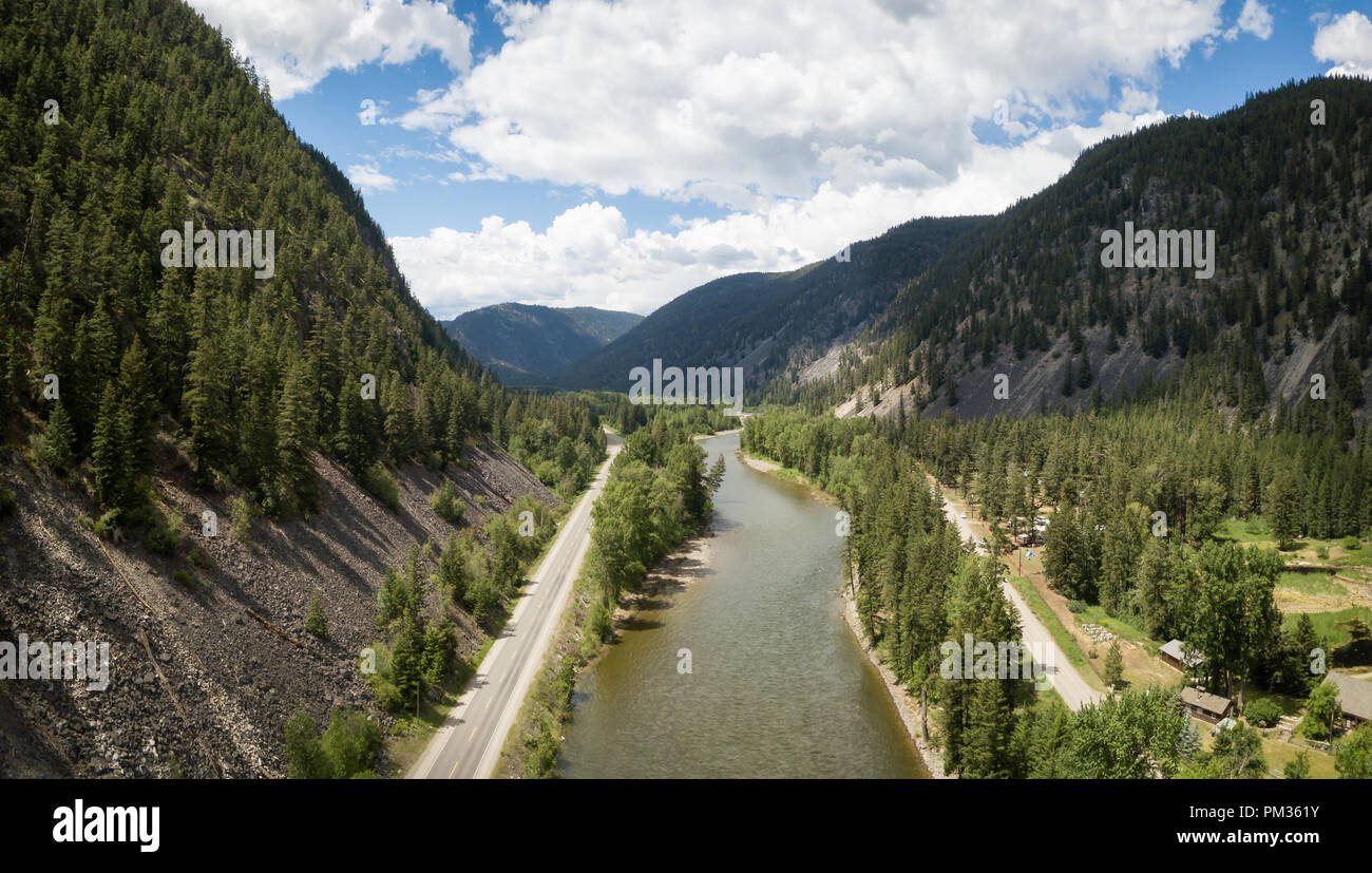 Aerial panoramic view of a scenic road going through the valley ...
