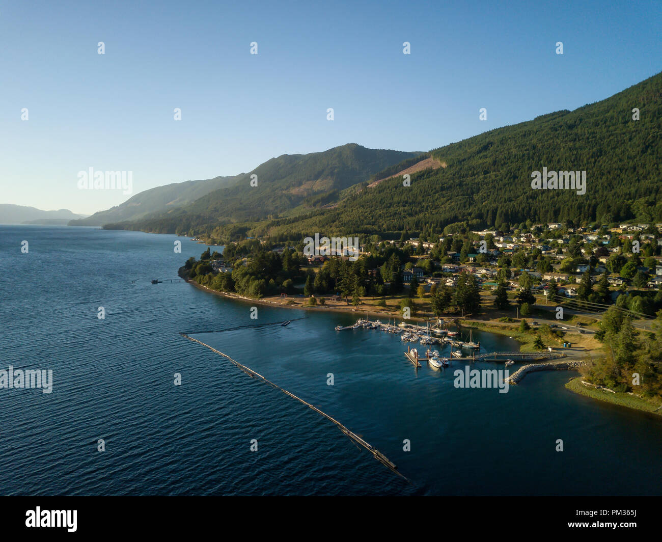Aerial view of a small town, Port Alice, during a sunny summer sunset ...