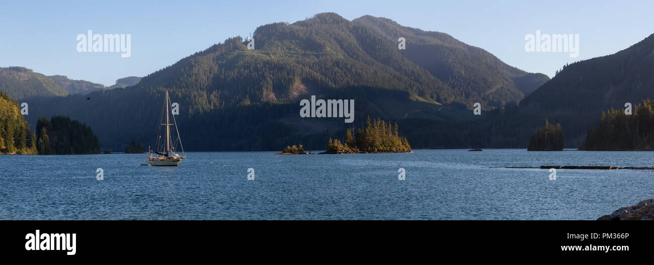 Beautiful panoramic landscape view of an ocean inlet with a sail boat ...